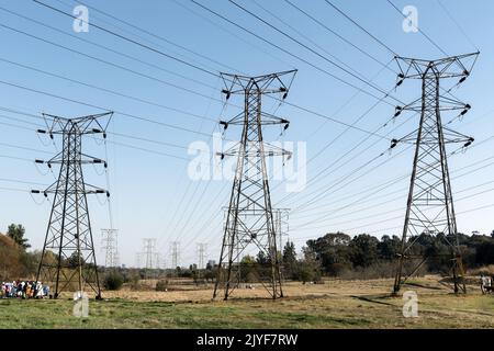 Multiple Overhead Electrical Powerlines traversing urban green space ...