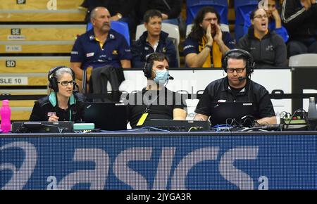 Officials are seen on the bench during the Round 11 Super Netball match ...