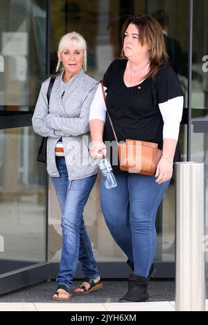 Jodie Reynolds (left), the mother of Nathan Reynolds, leaves during a ...