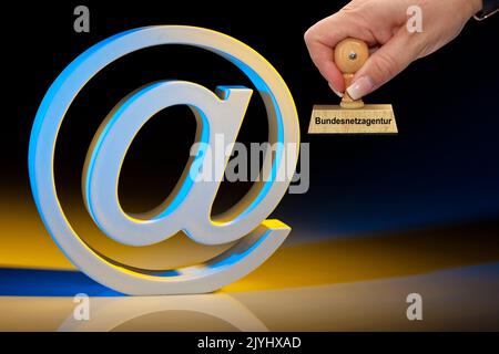 hand with stamp ketteriung Bundesnetzagentur, Federal Network Agency ...