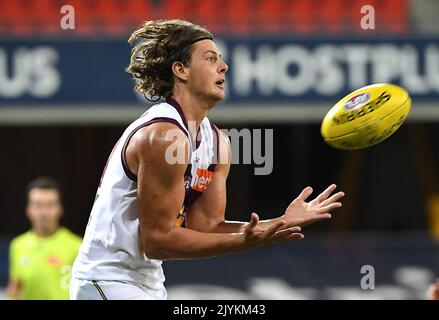 Tom Fullarton of the Lions takes a mark during the Community Series Pre ...