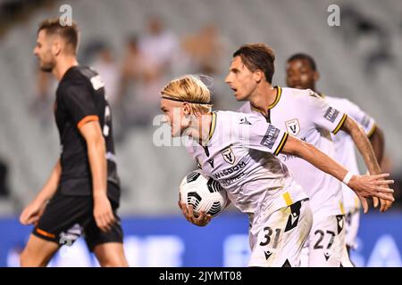 Lachlan Rose of Macarthur briefly celebrates his goal as he runs the ...