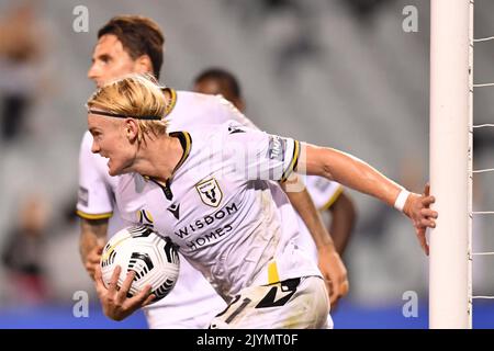 Lachlan Rose of Macarthur briefly celebrates his goal as he runs the ...