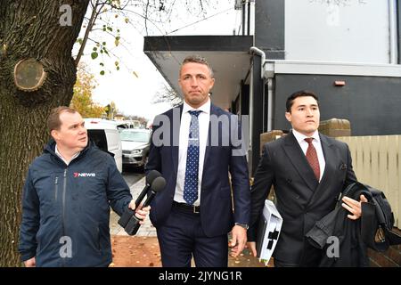 Former NRL player Sam Burgess (left) arrives with his lawyer Brian ...