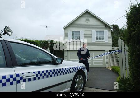 Mornington, Victoria, June 23, 2004. Police searching the yard at the ...