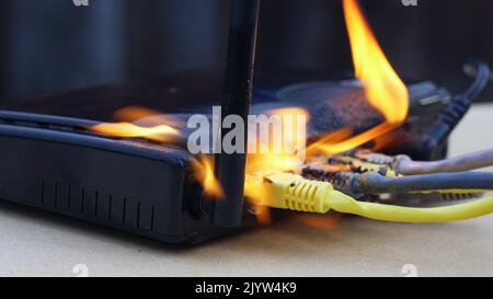 Burning Internet cable due to high congestion Stock Photo - Alamy