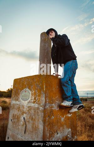Guy with balaclava smoking a joint of marijuana Stock Photo - Alamy