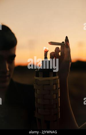 Young couple smoking a joint Stock Photo - Alamy
