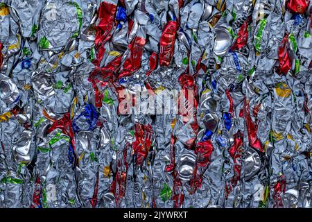 Waste processing, waste sorting. Recycled tin can waste compressed into ...