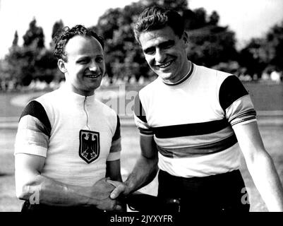 Olympic cyclist Reg Harris right trains on the road with left to right ...