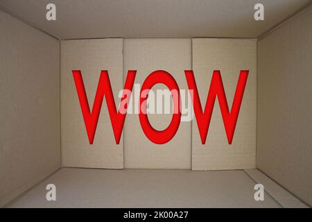 Wow word with cardboard box. Brown folded card box Stock Photo - Alamy