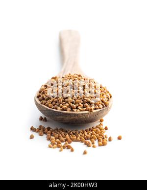 Uncooked buckwheat grain in wooden scoop on the wooden table Stock ...