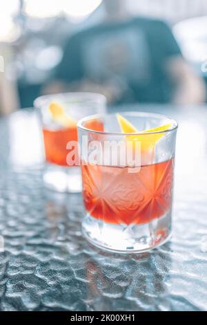Boulevardier cocktail and orange zest on rusty background Stock Photo ...