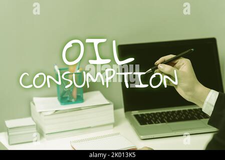 Hand writing sign Oil ConsumptionThis entry is the total oil consumed ...