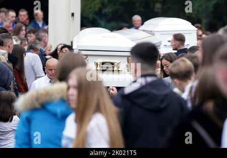 The coffins carrying the remains of Lisa Cash, 18, and her eight-year ...