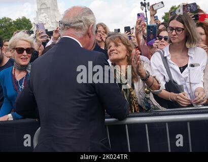 Queen Camilla is greeted by a well wisher as she arrives to attend a ...