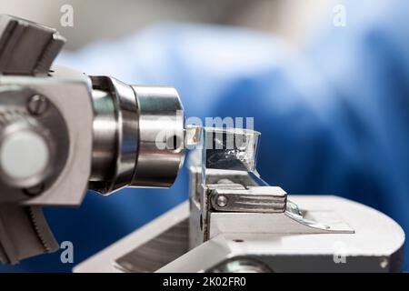 Closeup of an epoxy embedded tissue placed on the ultramicrotome to ...