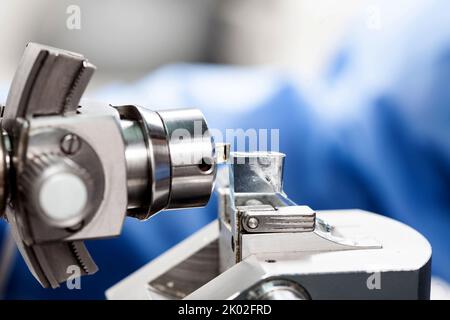 Closeup of an epoxy embedded tissue placed on the ultramicrotome to ...