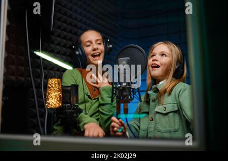 Kids singing in record studio Stock Photo - Alamy
