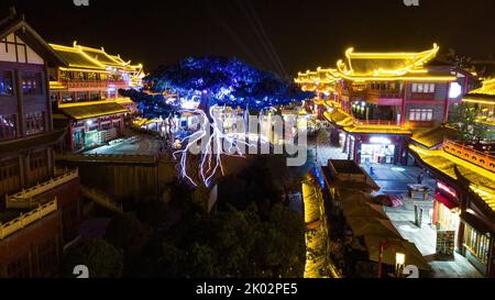 The illuminated buildings of the Impression Water street in Meishan ...