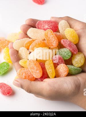 Multicolor gummy candy on red background close-up, top view Stock Photo ...