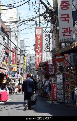 Traditional shopping street with series of small shops. Seoul, South ...
