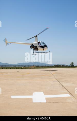 A helicopter taking off from airfield Stock Photo - Alamy
