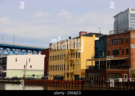 Buildings along Cuyahoga River with the Main Avenue bridge, Cleveland ...