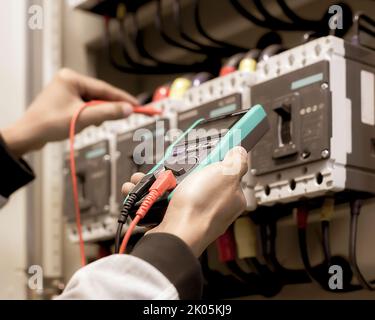 Engineering services concept. Electrical engineer use computer laptop ...