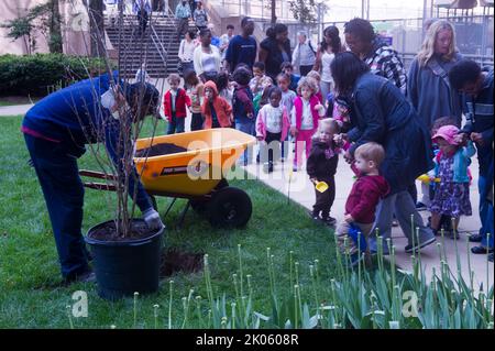 Earth Day tree planting event, with children outside HUD headquarters ...