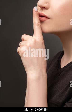 Female gossip. Shush gesture. Dont speak. Special surprise. Portrait of ...