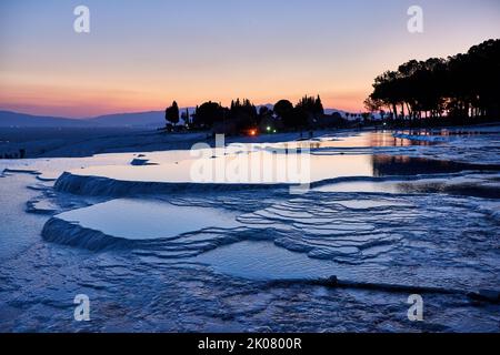 Natural travertine pools and terraces at sunset - Pamukkale, Turkey ...
