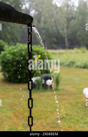 water trickling down a chain hanging from a gutter Stock Photo - Alamy