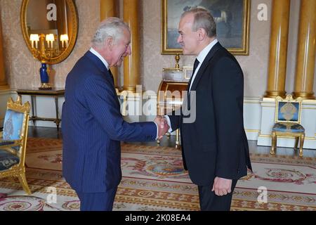 Queen Camilla shakes hands with Sir Gerald Ronson during her visit to ...