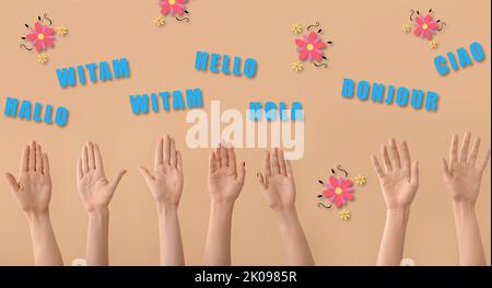Many raised hands and words HELLO in different languages on blue ...