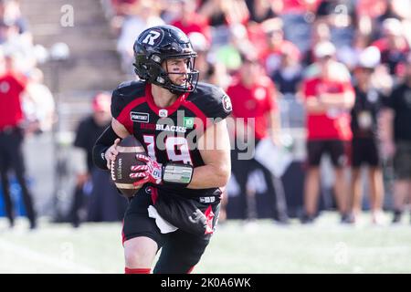 quarterback Nick Arbuckle #4 of Toronto Argonauts looks to pass in the ...