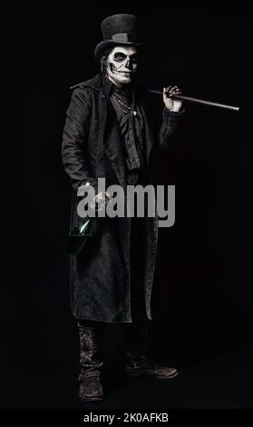 A young man in image of Baron Samedi, the Voodoo deity. Baron Saturday ...