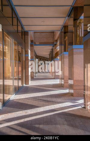 Building pillars outside corridor and glass doors. Corridor of brick ...