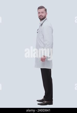 Side view portrait of smiling pediatrician using stethoscope while ...