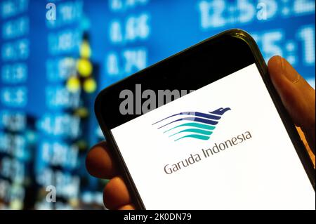 In this photo illustration, the Garuda Indonesia logo is displayed on a ...