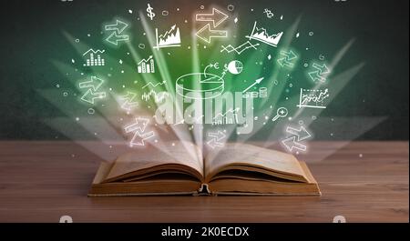 Open book with currency icons above Stock Photo - Alamy