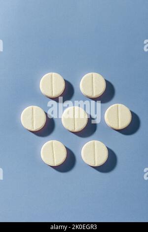 Soluble tablets on blue background Stock Photo - Alamy