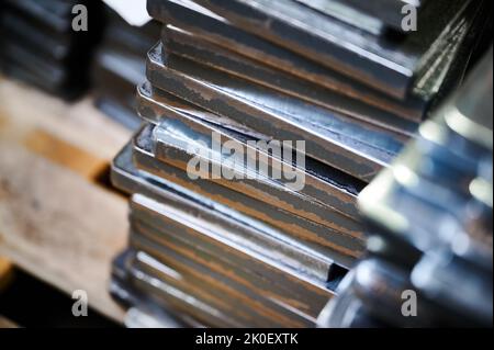 Shiny rectangle metal details on wooden pallet in warehouse Stock Photo ...