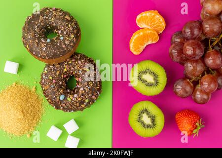 Green vegetables s vs donuts. Unhealthy food and health problems. High ...