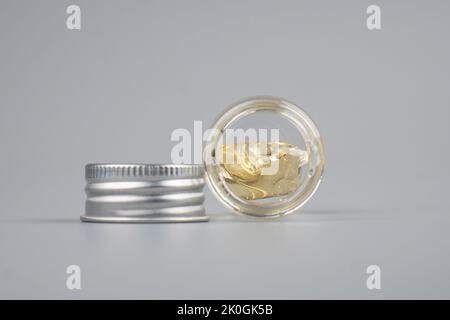 piace cannabis extract wax with transparent bottle closeup on gray ...