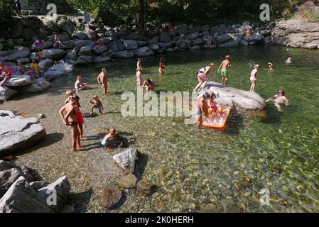 OSOGNA, SWITZERLAND - AUGUST 10, 2022: people enjoy the Osogna ...