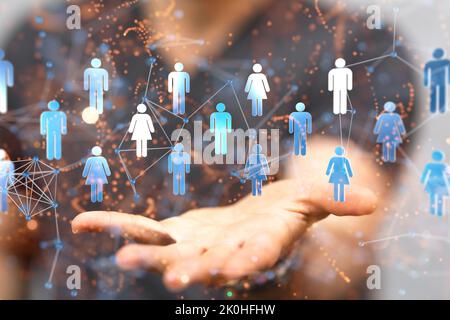 The 3d rendered people icons hovering over a man's hand Stock Photo - Alamy