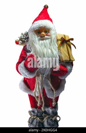 A vertical shot of a Santa Claus doll in a house Stock Photo - Alamy
