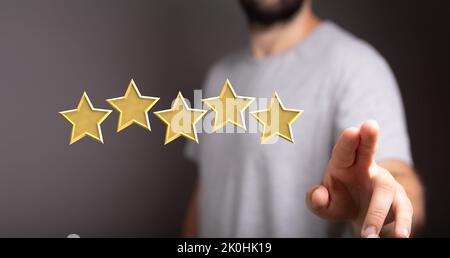 A person presenting the virtual projection of five stars ranking Stock ...