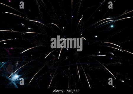 The falling of firework sparks after bursting in the night sky Stock ...